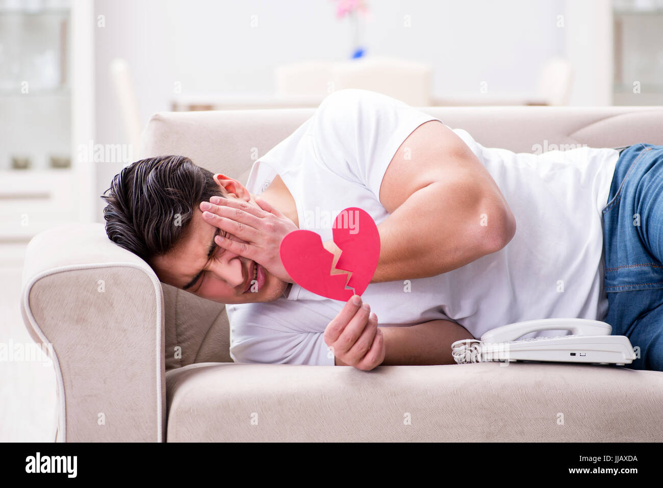 Young man in sad saint valentine concept Stock Photo - Alamy