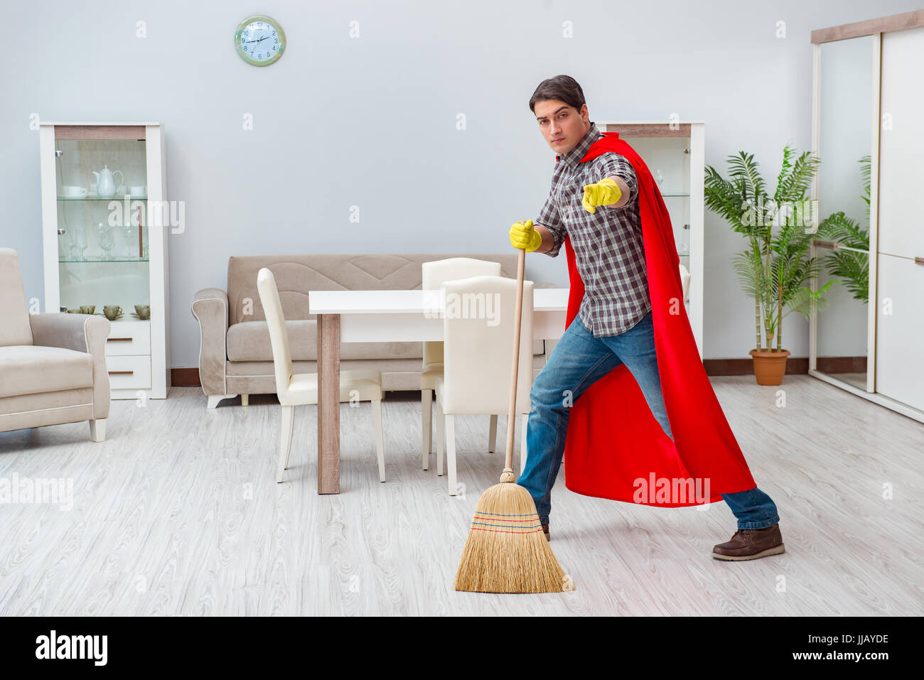 Super hero cleaner working at home Stock Photo - Alamy