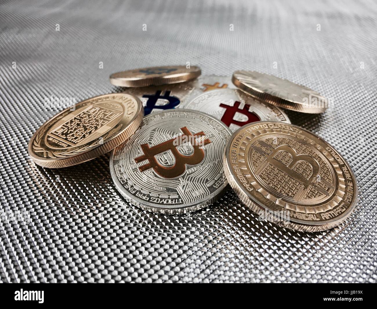 Digital currency physical gold and silver colorful bitcoins on the ...