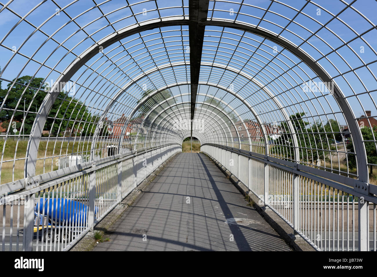 Enclosed pedestrian footbridge with steel safety cage, over m60 ...