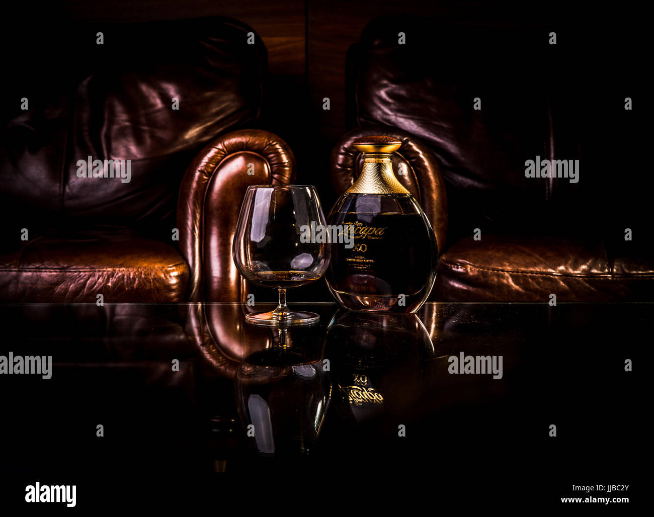 Luxury interior, high class lounge with top end rum and leather chairs ...