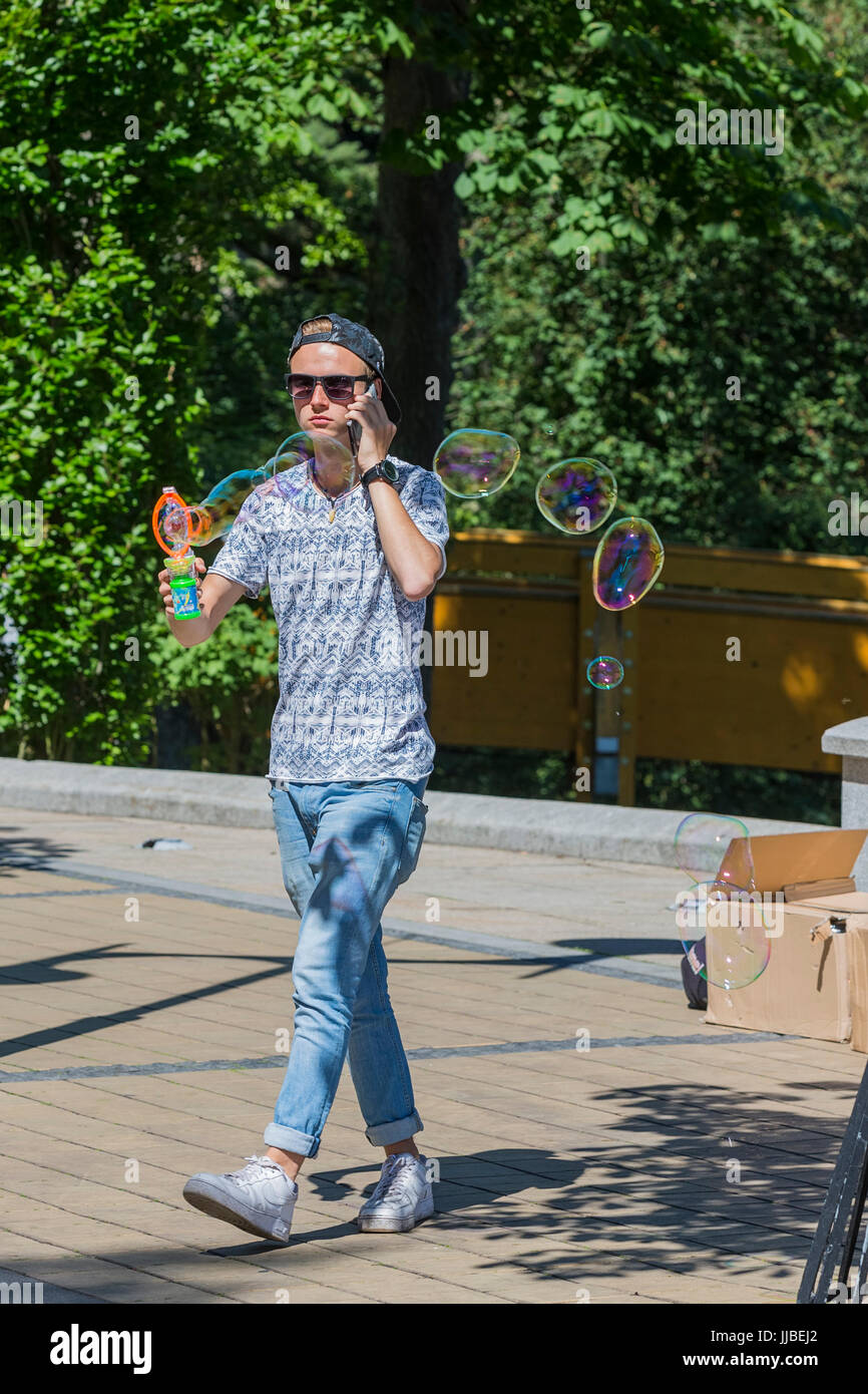 A young man sells soap bubbles Stock Photo - Alamy
