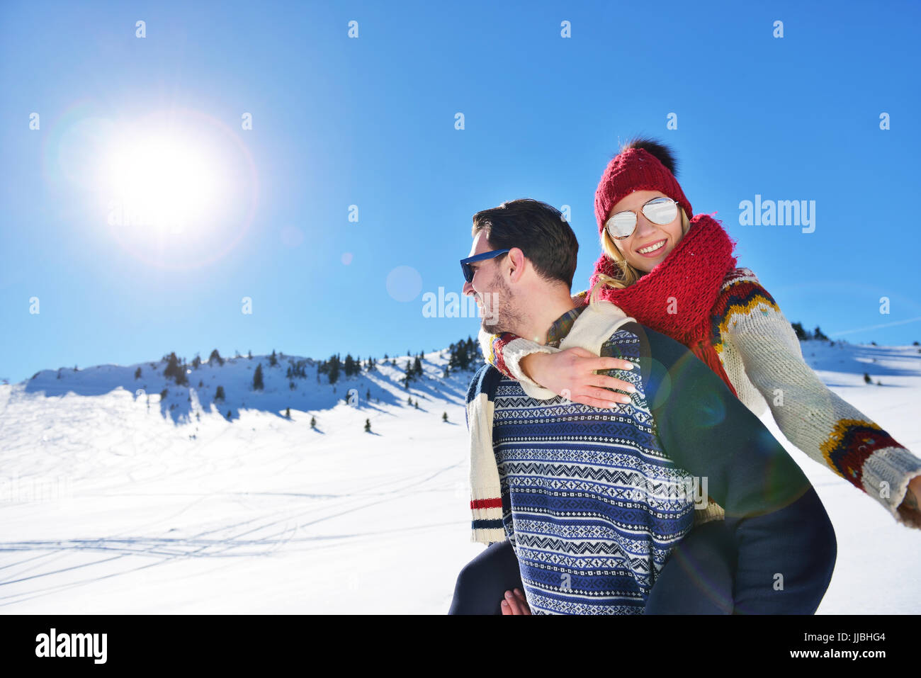 Loving couple playing together in snow outdoor Stock Photo - Alamy