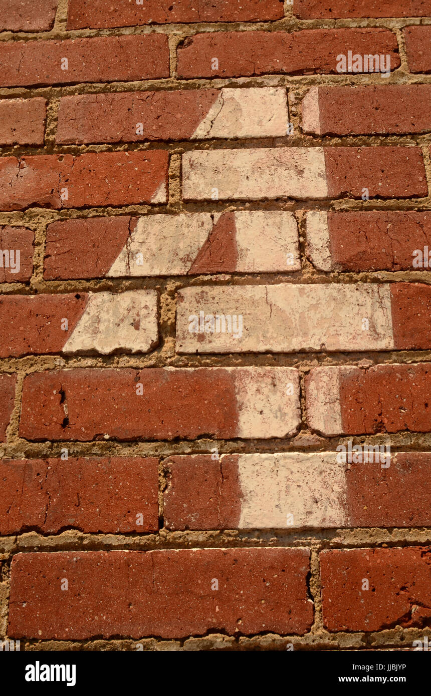 vintage ghost sign number four painted on red brick Stock Photo - Alamy