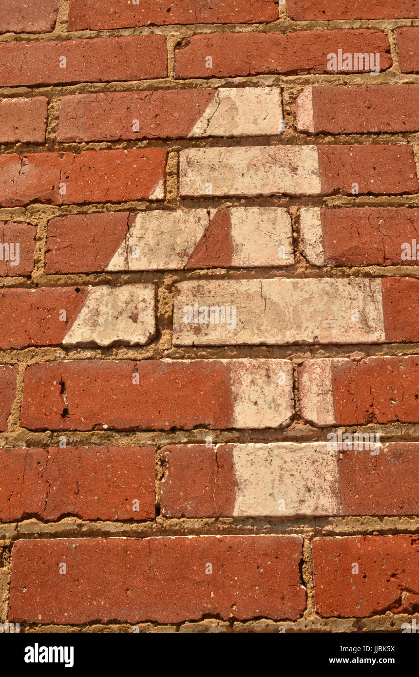 vintage ghost sign number four painted on red brick Stock Photo - Alamy
