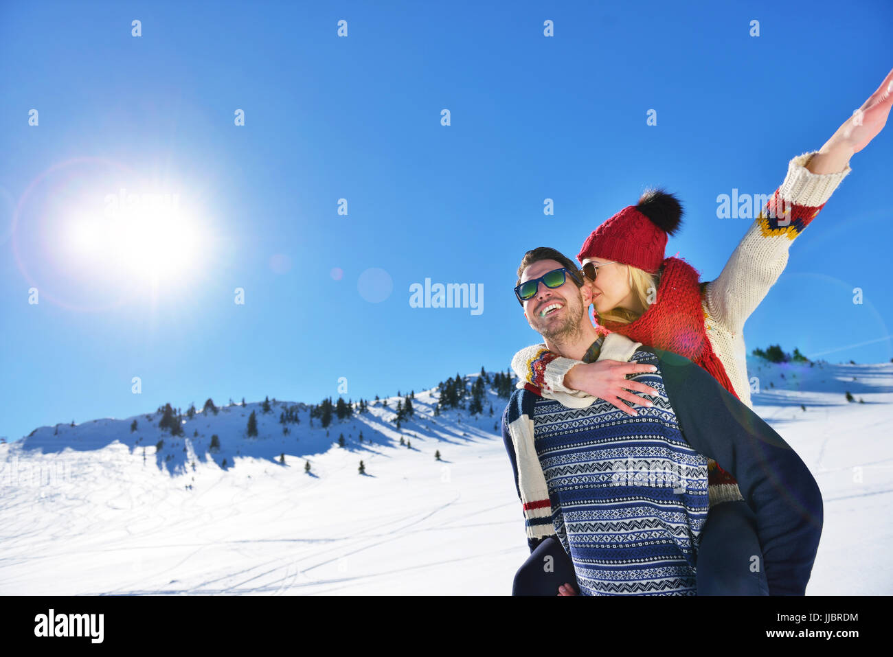 Loving couple playing together in snow outdoor Stock Photo - Alamy