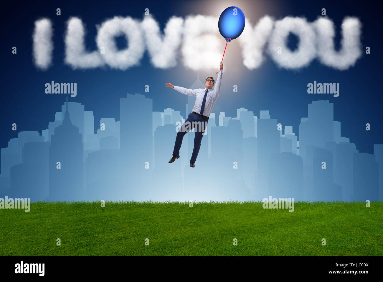 Man flying balloons in romantic concept Stock Photo - Alamy