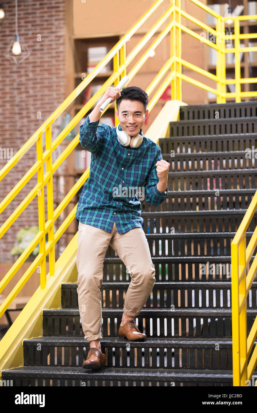 Young man on the stairs Stock Photo - Alamy