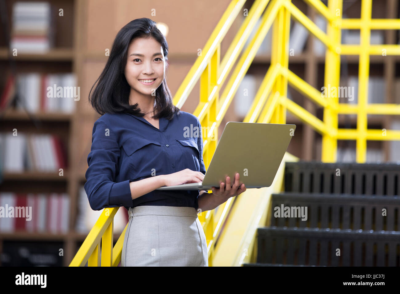 Business lady using laptop Stock Photo - Alamy