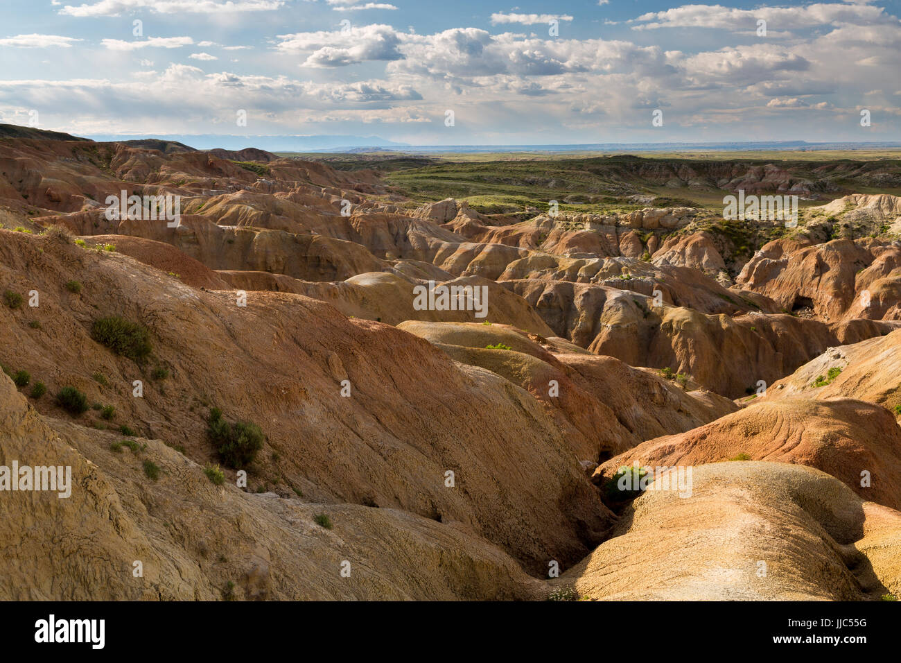 Clouds passing over badlands hills in the high desert of north-central ... Clouds passing over badlands hills in the high desert of north-central ...