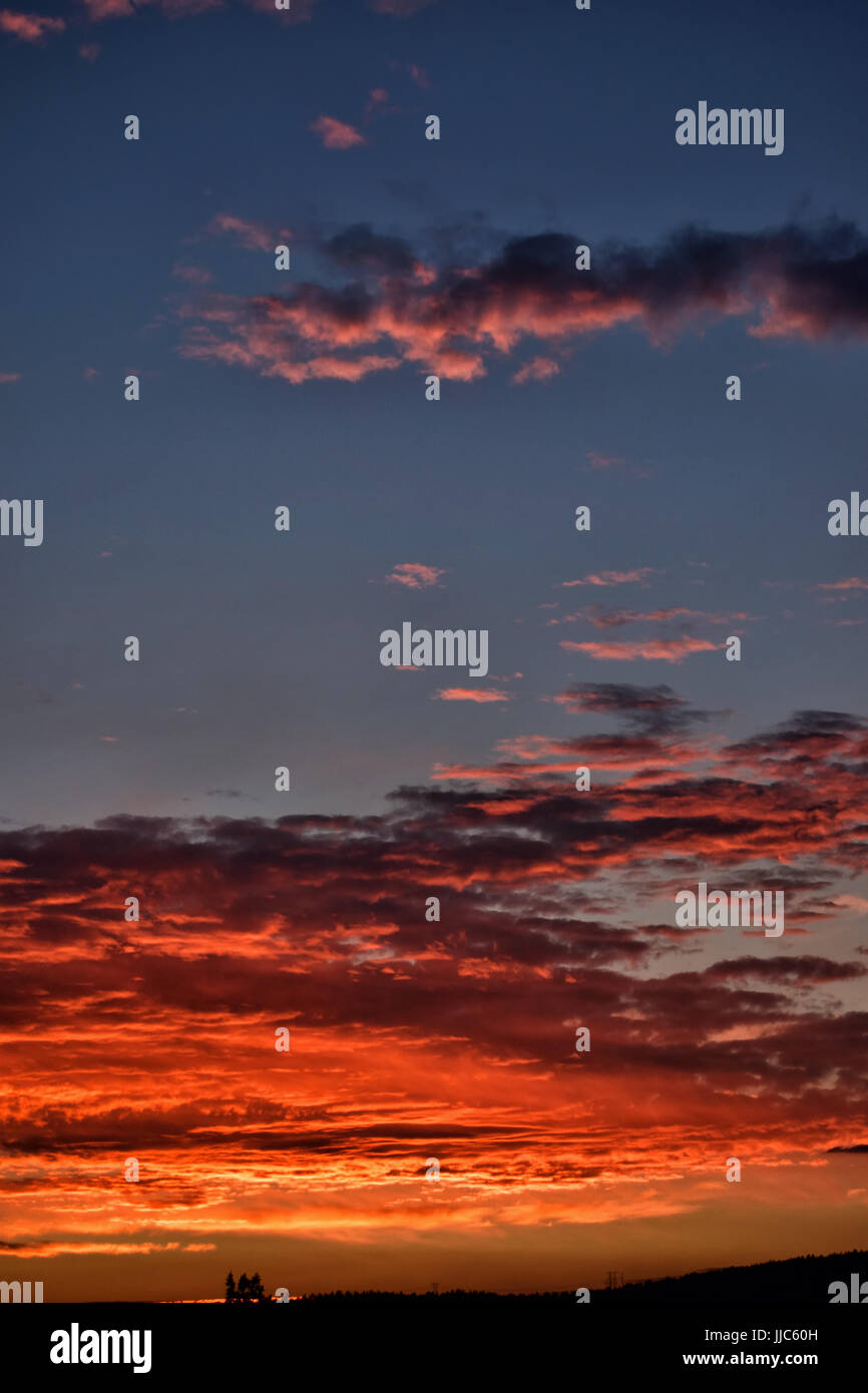Coral orange sunset clouds for background Stock Photo - Alamy