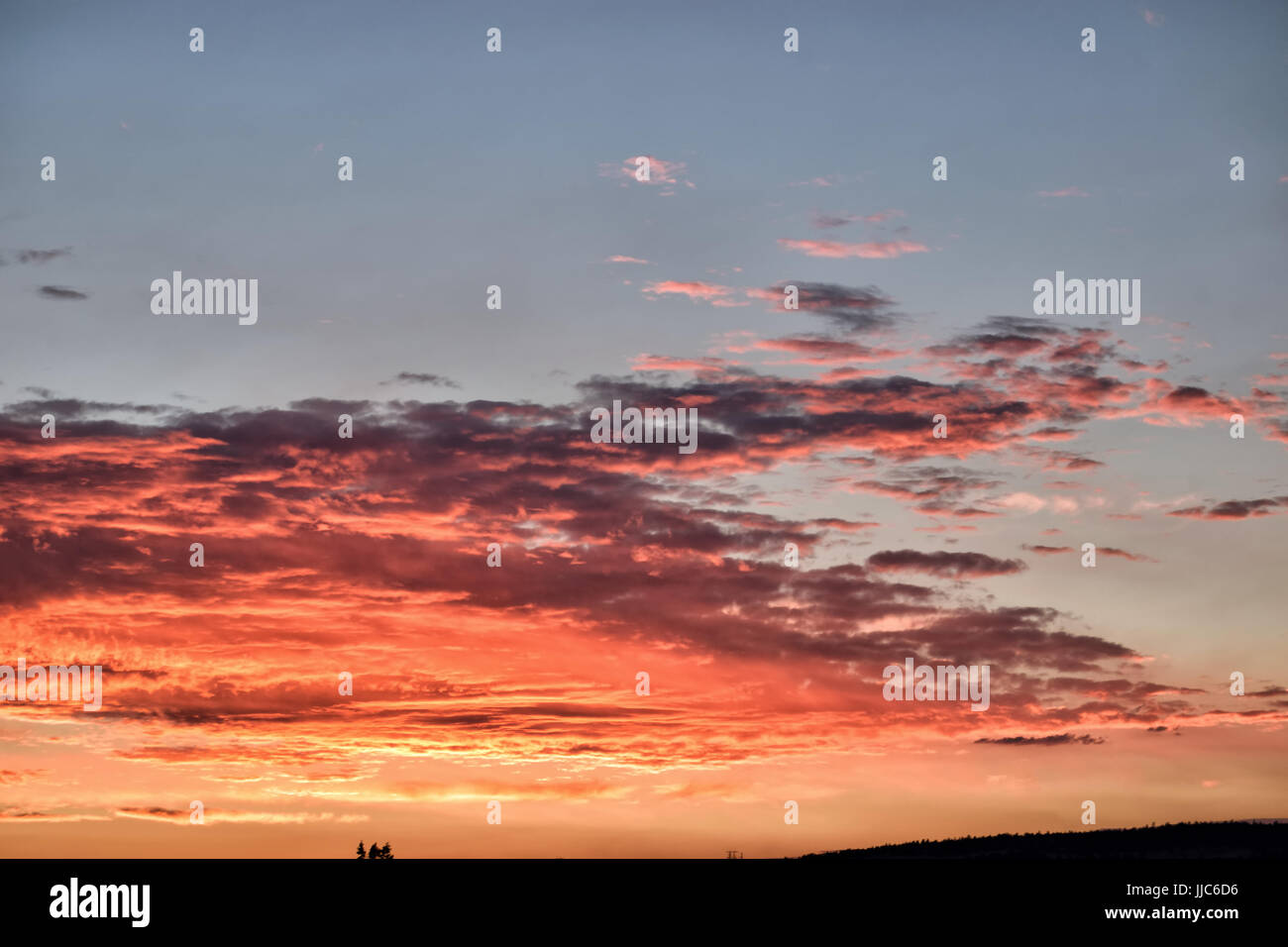Coral orange sunset clouds for background Stock Photo - Alamy