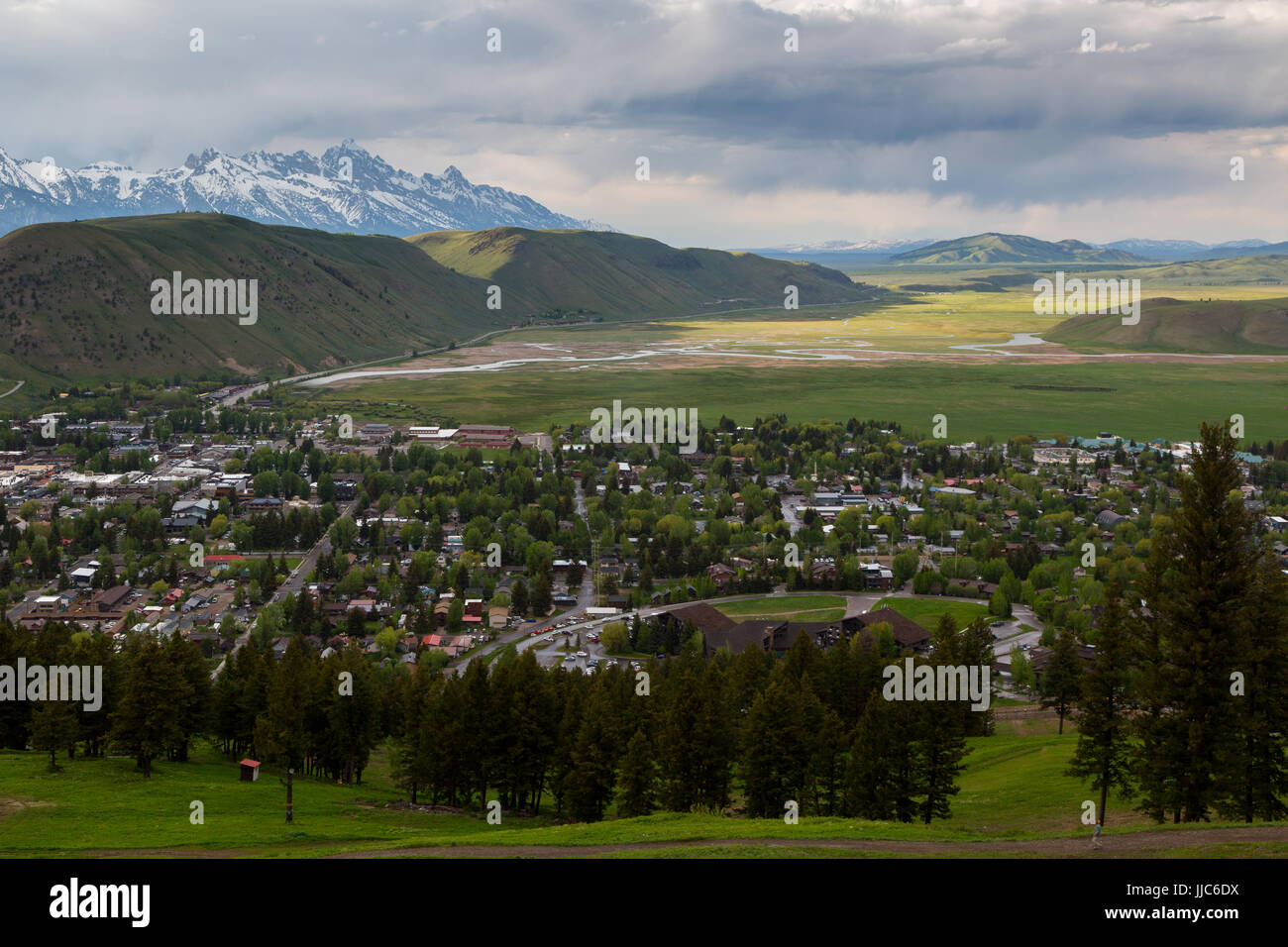 The town of Jackson nestled at the base of Snow King Mountain below the ...