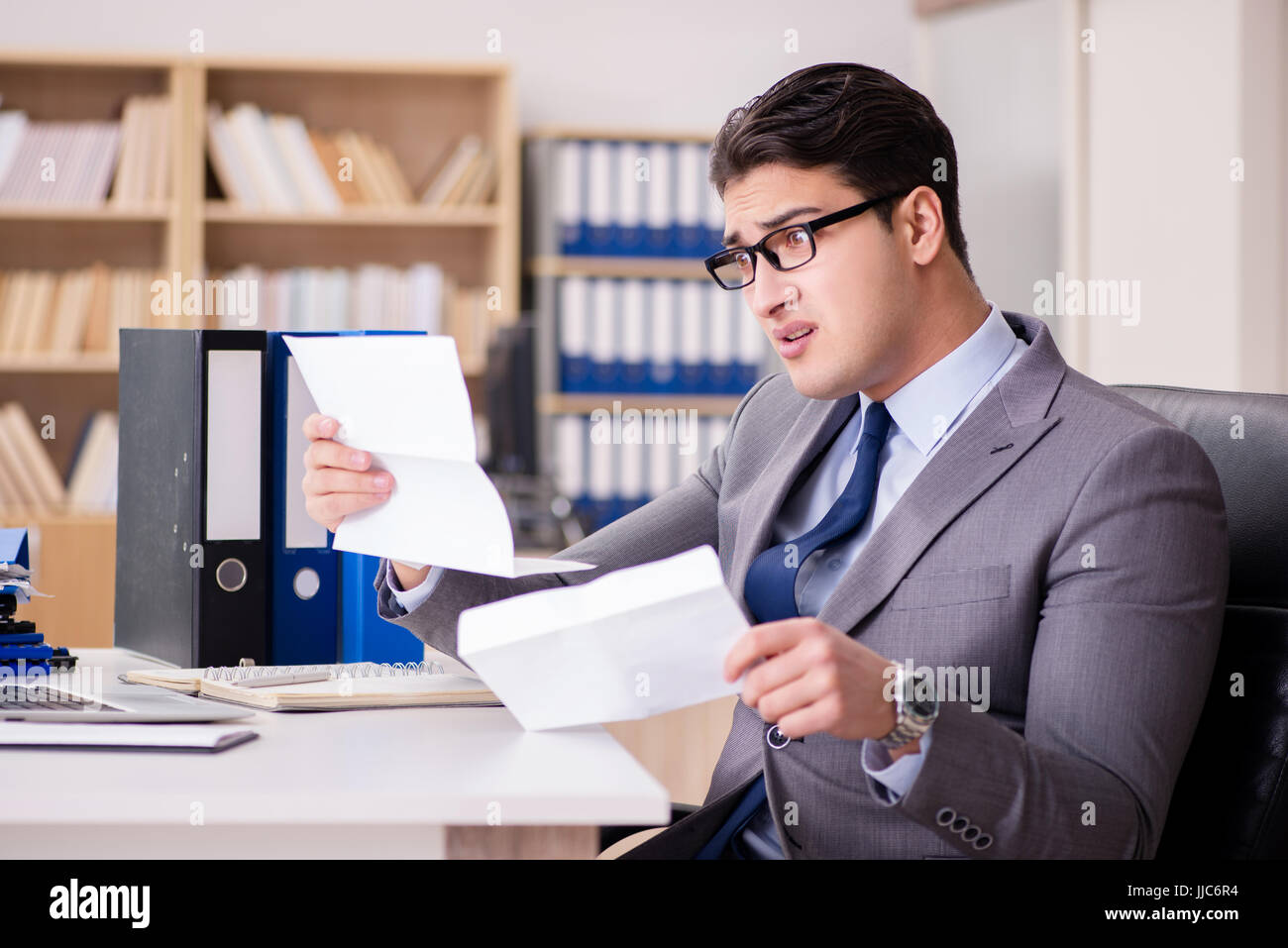 Businessman receiving letter in the office Stock Photo - Alamy
