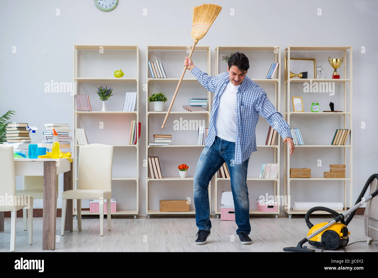 Man doing cleaning at home Stock Photo - Alamy