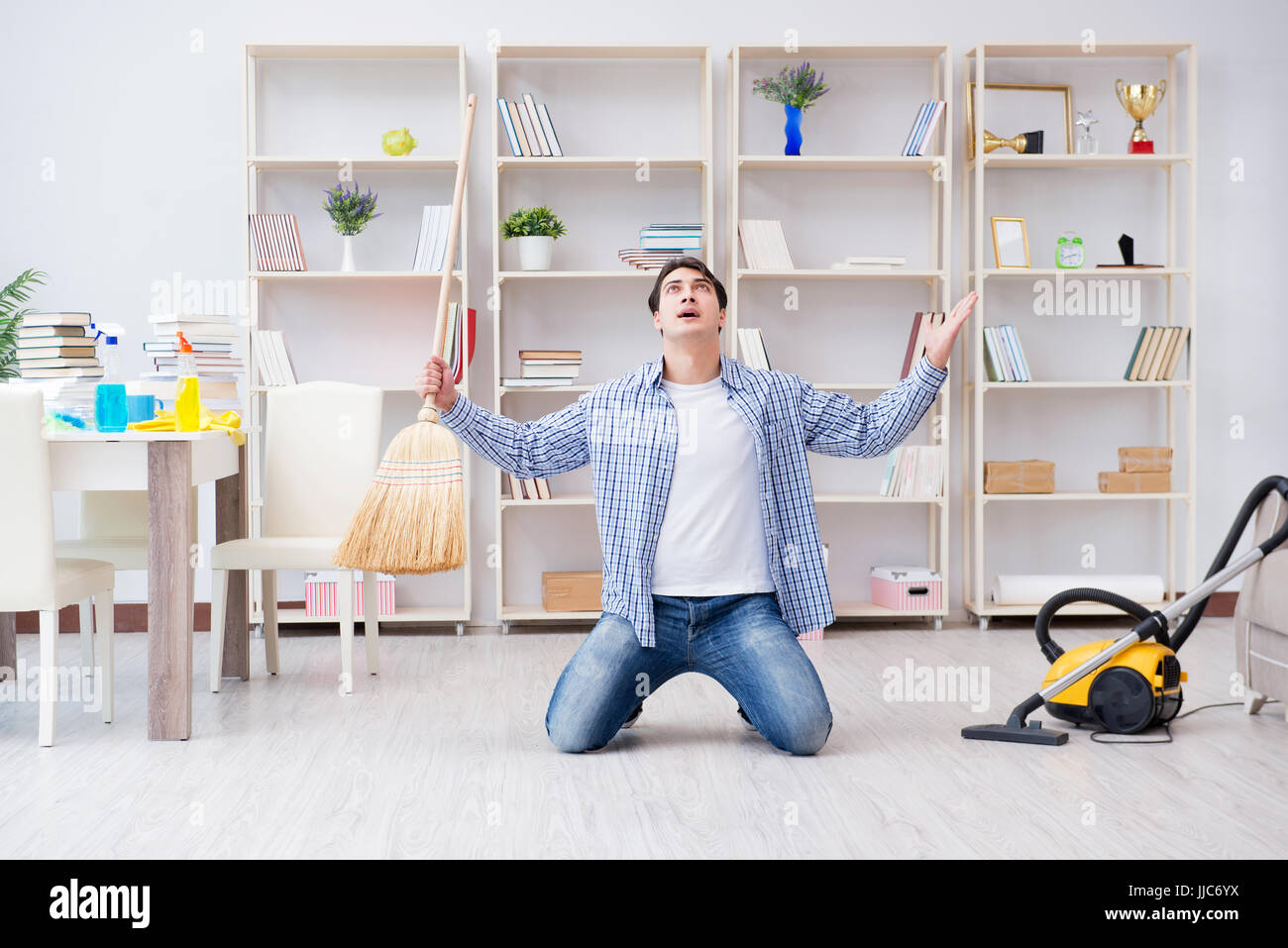 Man doing cleaning at home Stock Photo - Alamy