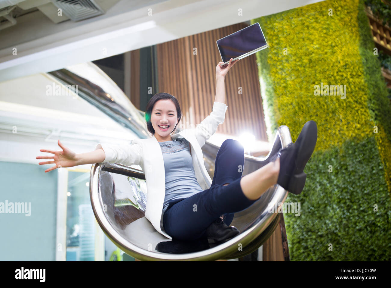 Woman sliding on slide hi-res stock photography and images - Alamy