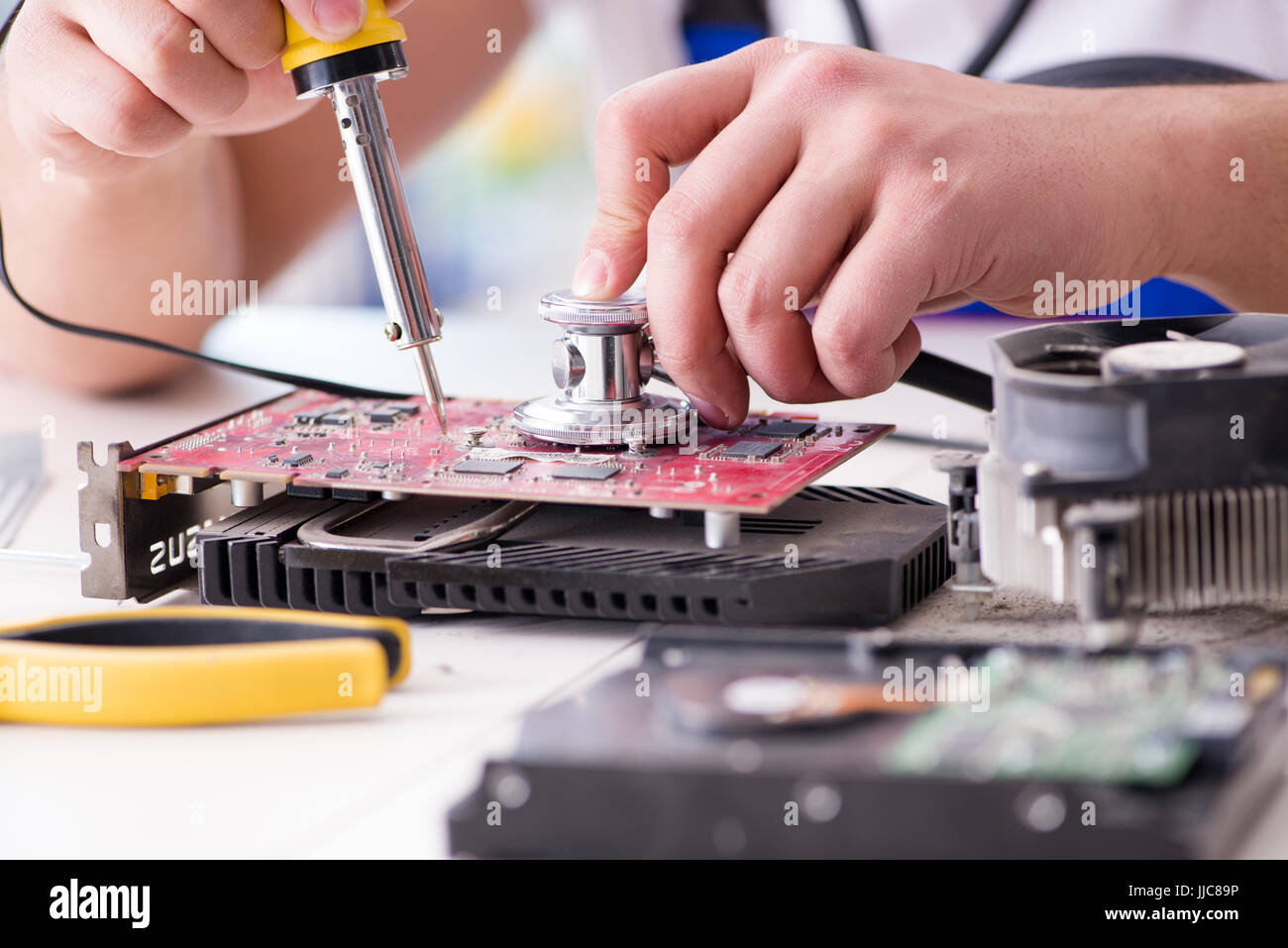 Computer repairman repairing desktop computer Stock Photo - Alamy