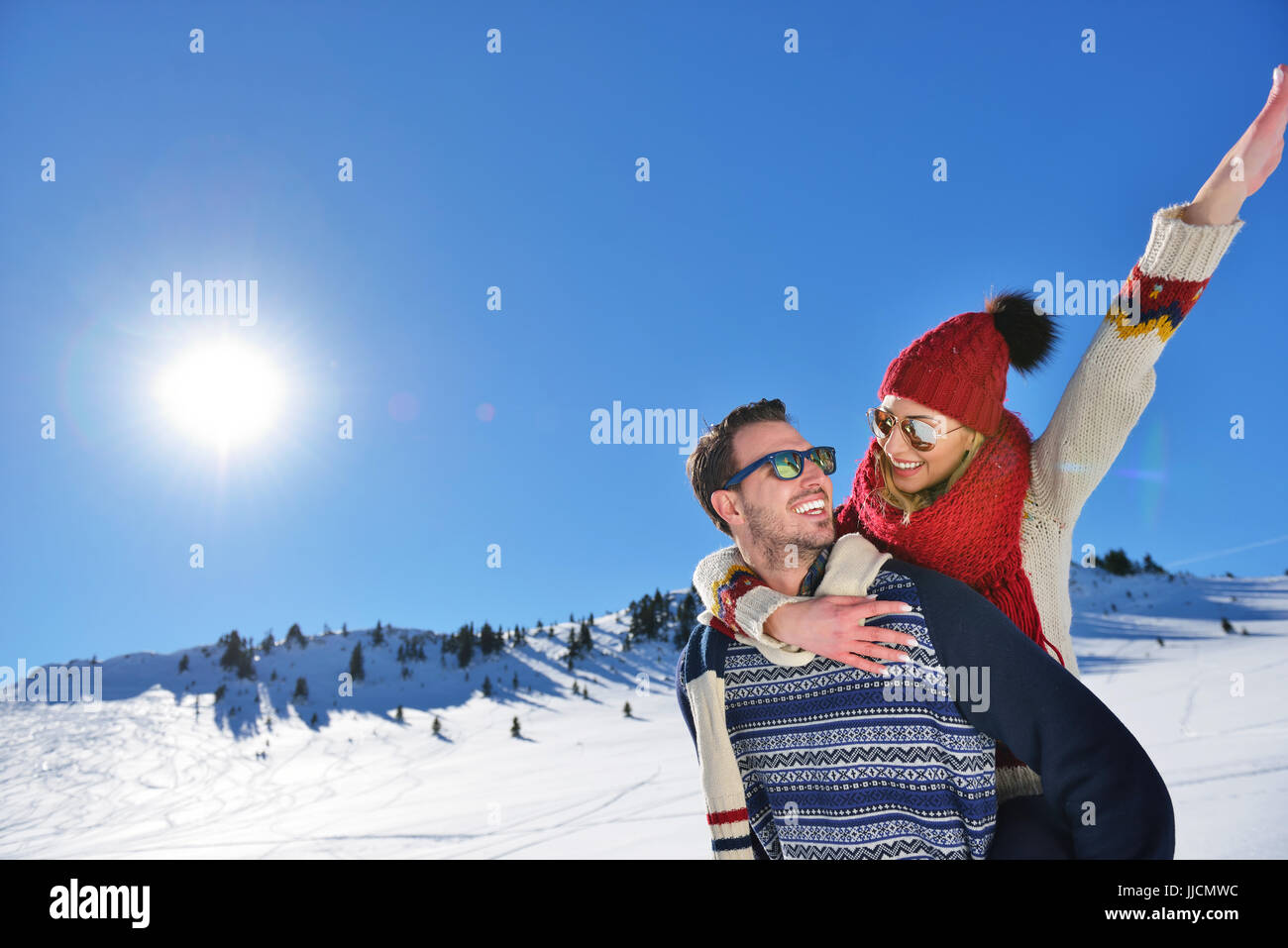 Loving couple playing together in snow outdoor Stock Photo - Alamy
