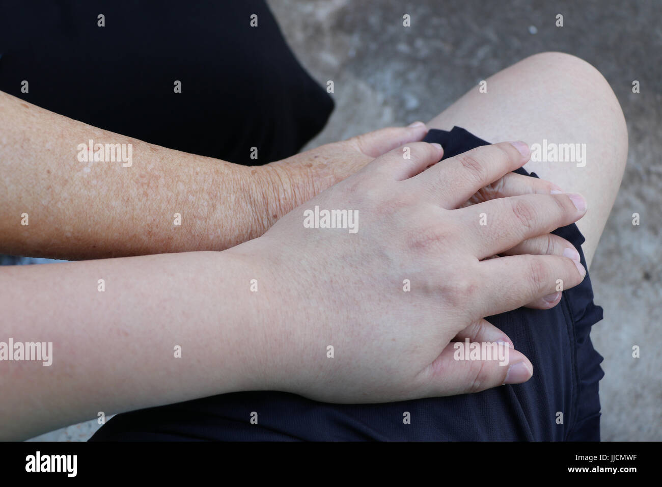 hand in hand,hand in cheerful meaning Stock Photo - Alamy