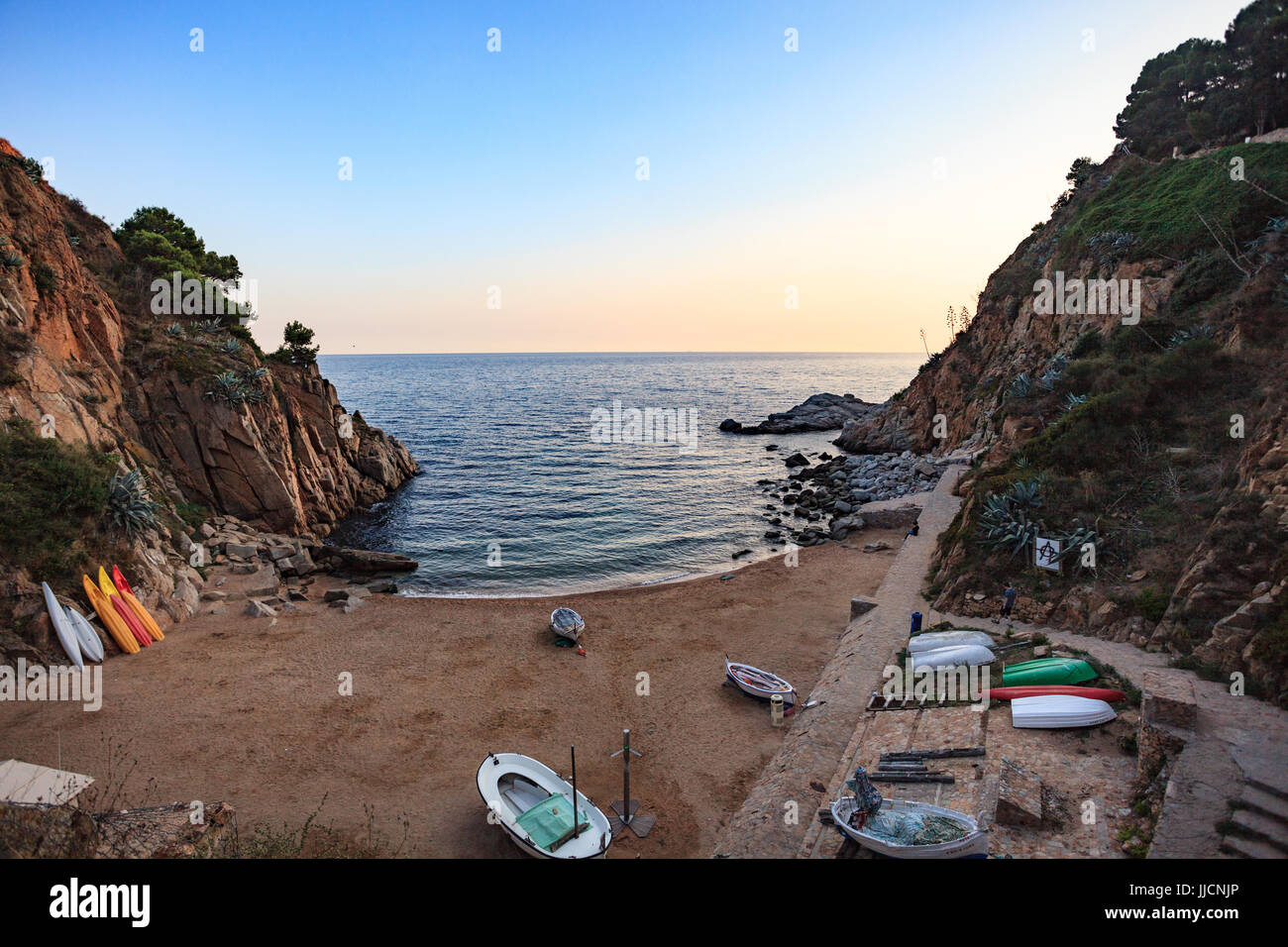 Platja d'es Codolar. View of the small beach in Tossa de Mar, at dawn ...