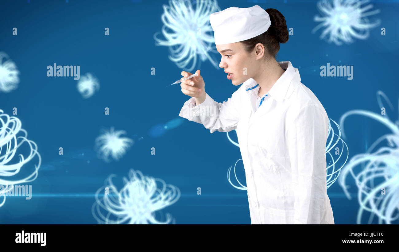 Beautiful medical woman doctor in uniform. Studio painted background ...