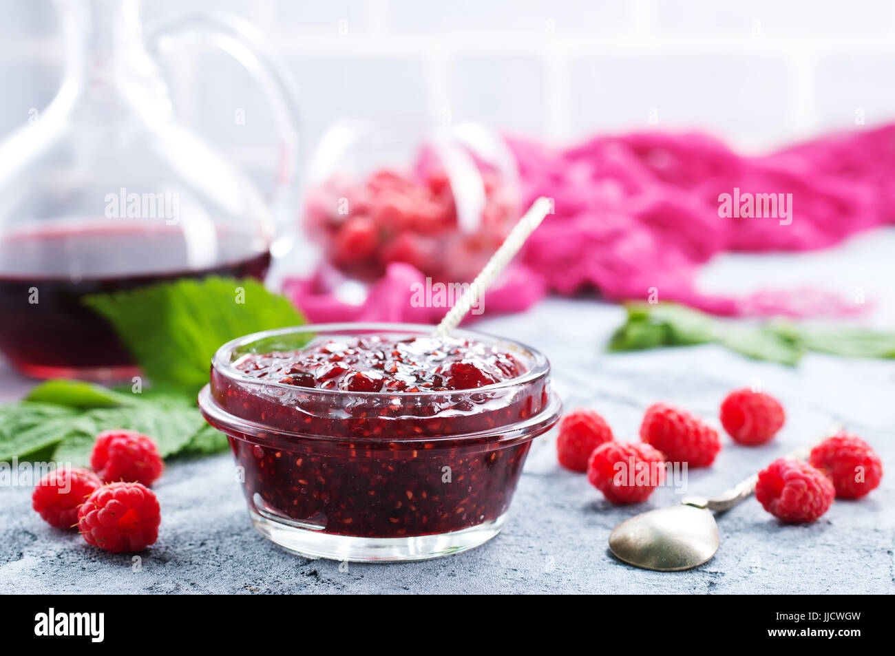 jam from rasspberry in bowl and on a table Stock Photo - Alamy