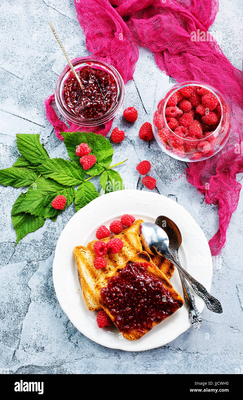 toasts with raspberry jam on the plate Stock Photo - Alamy