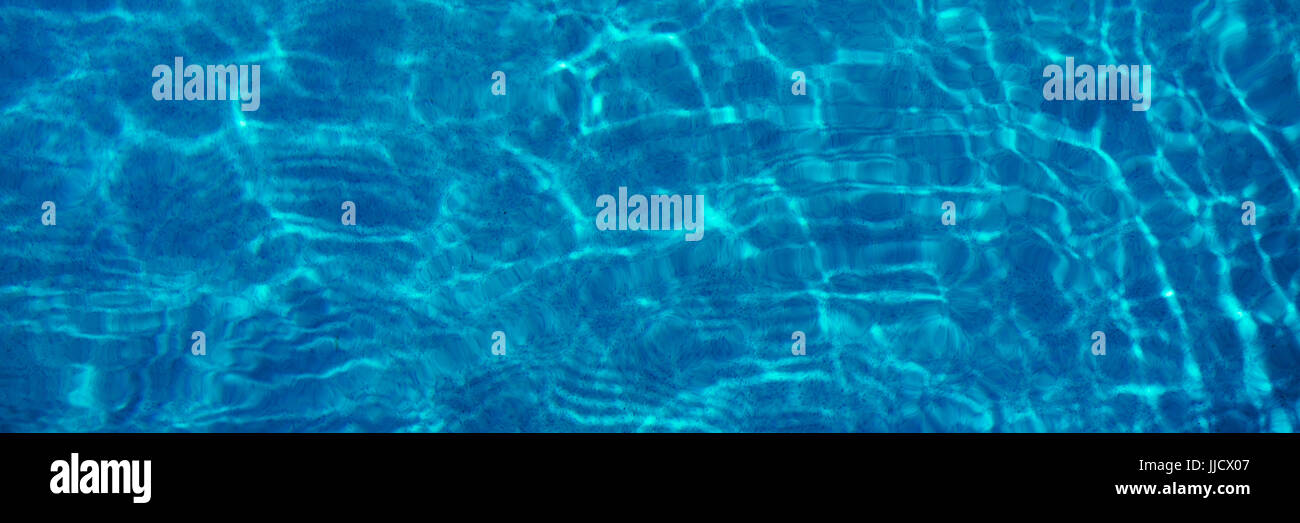 Water in swimming pool with sun reflection. Blue water. Water abstract ...
