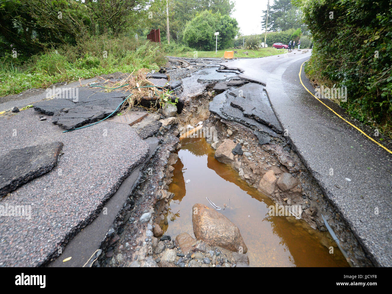 A damaged road in Coverack, Cornwall, after intense rain caused flash ...