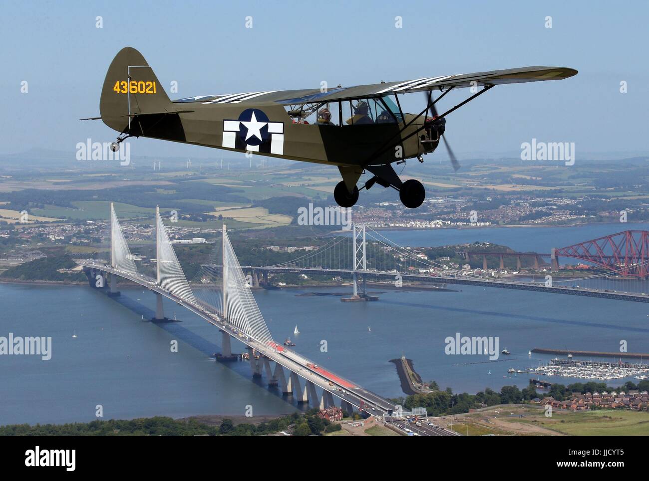 Jim McTaggart takes his 1940 Piper Cub, with its US Army D-Day ...