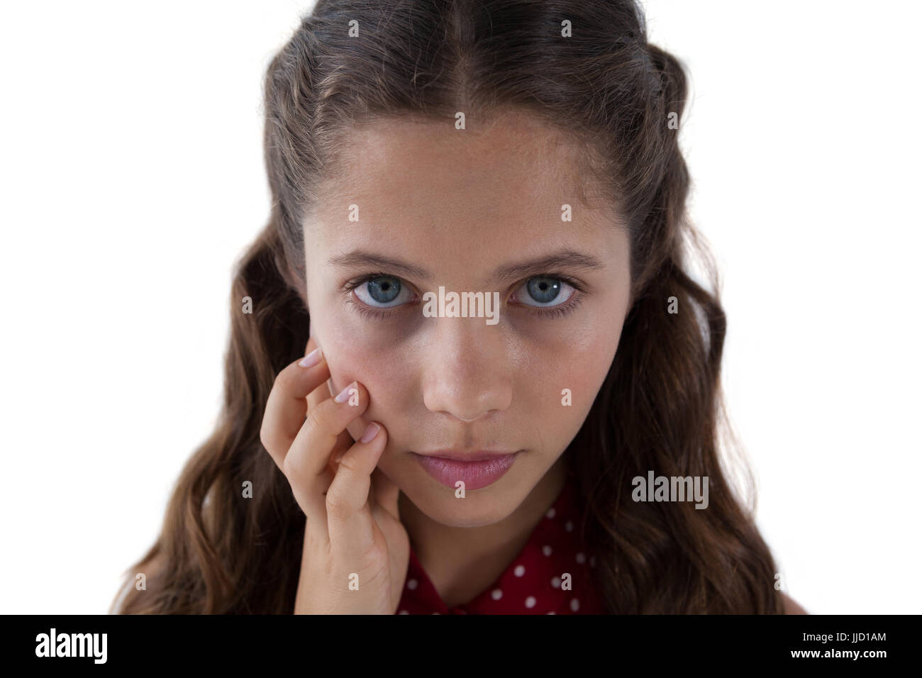 Portrait of scared girl standing against white background Stock Photo ...