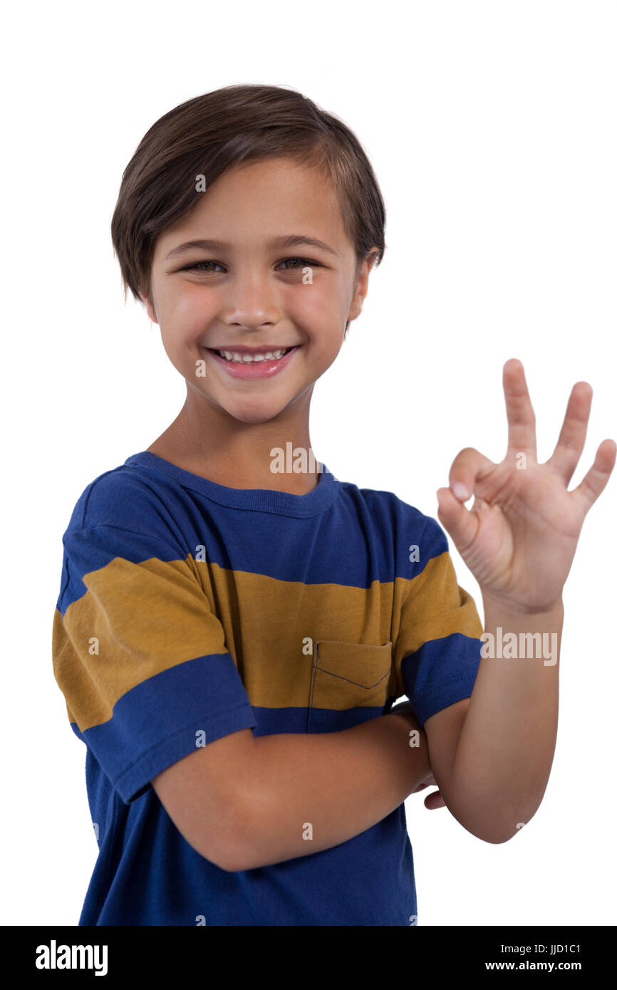 Smiling cute boy gesturing okay hand sign Stock Photo - Alamy