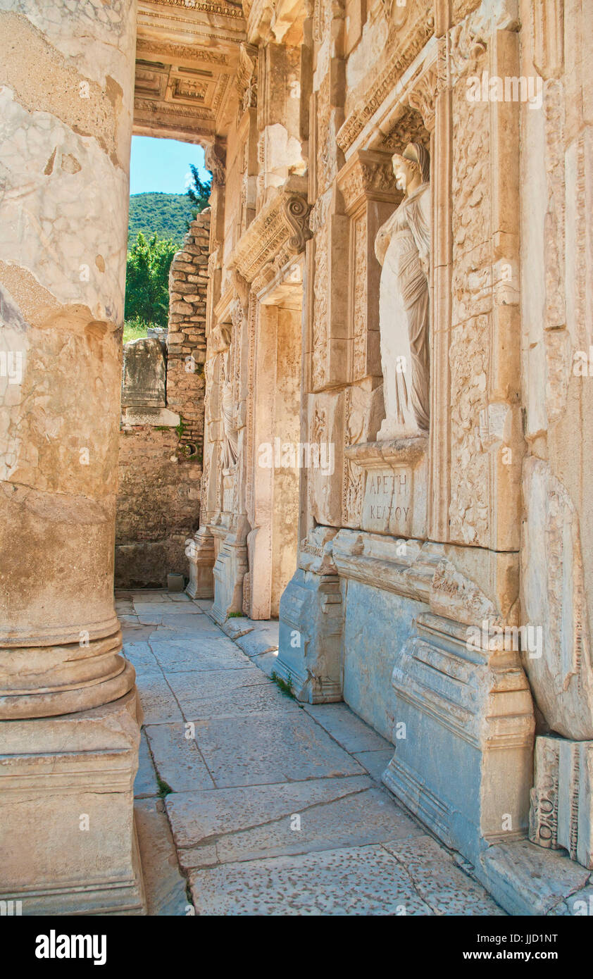 female statue in Celsus Library facade with a column in foreground and ...