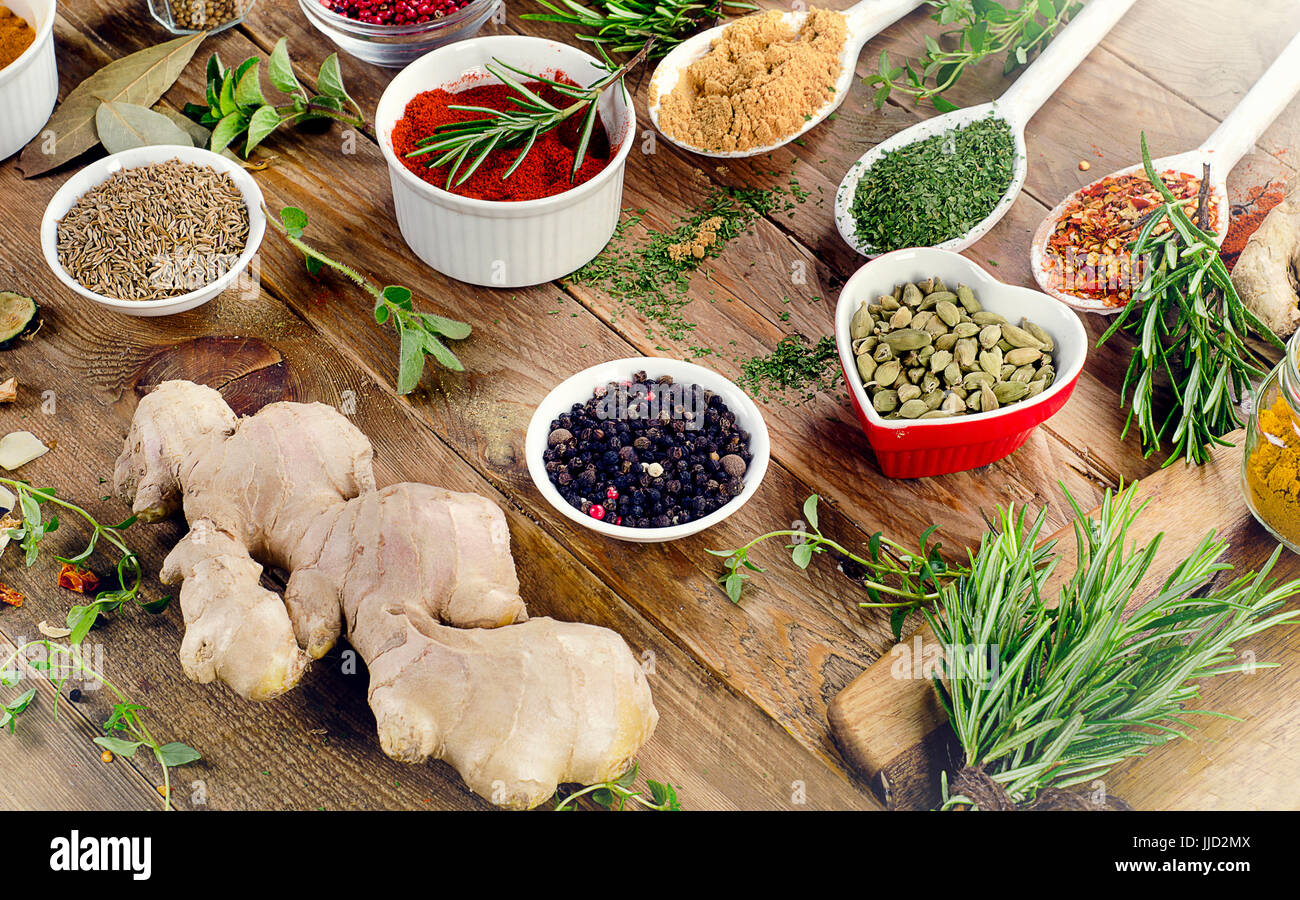 Various spices and herbs on rustic wooden background. Top view Stock ...