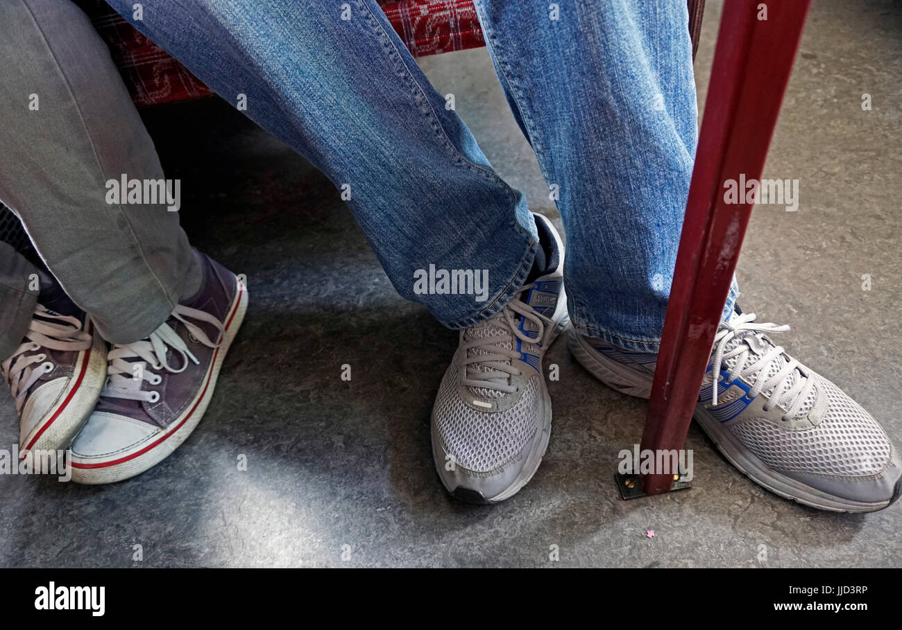 Feet under table hi-res stock photography and images - Alamy