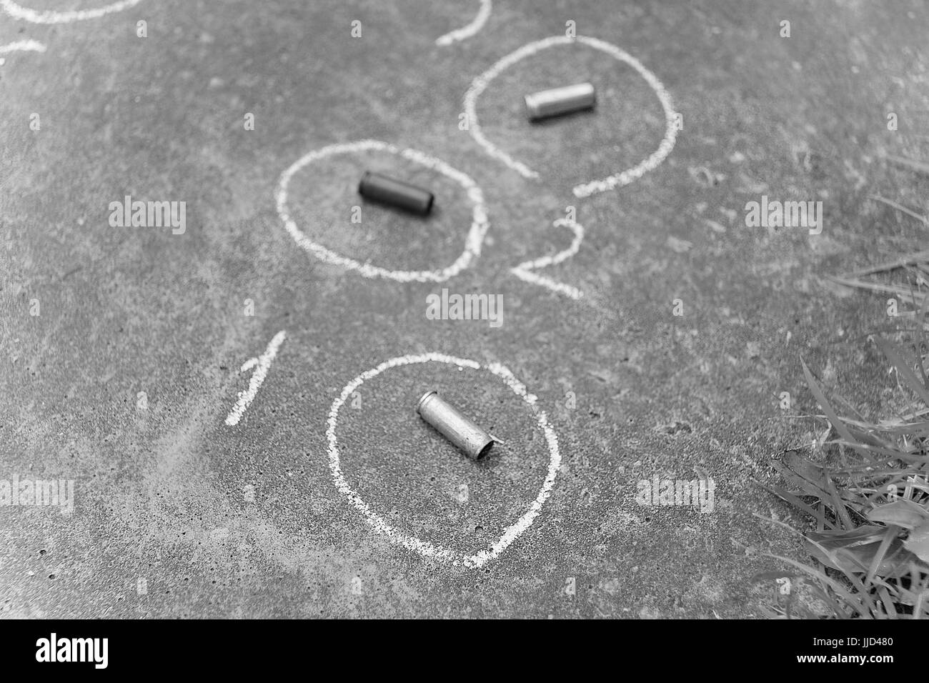 Crime scene with gun cartridges chalk outlines. In black and white ...