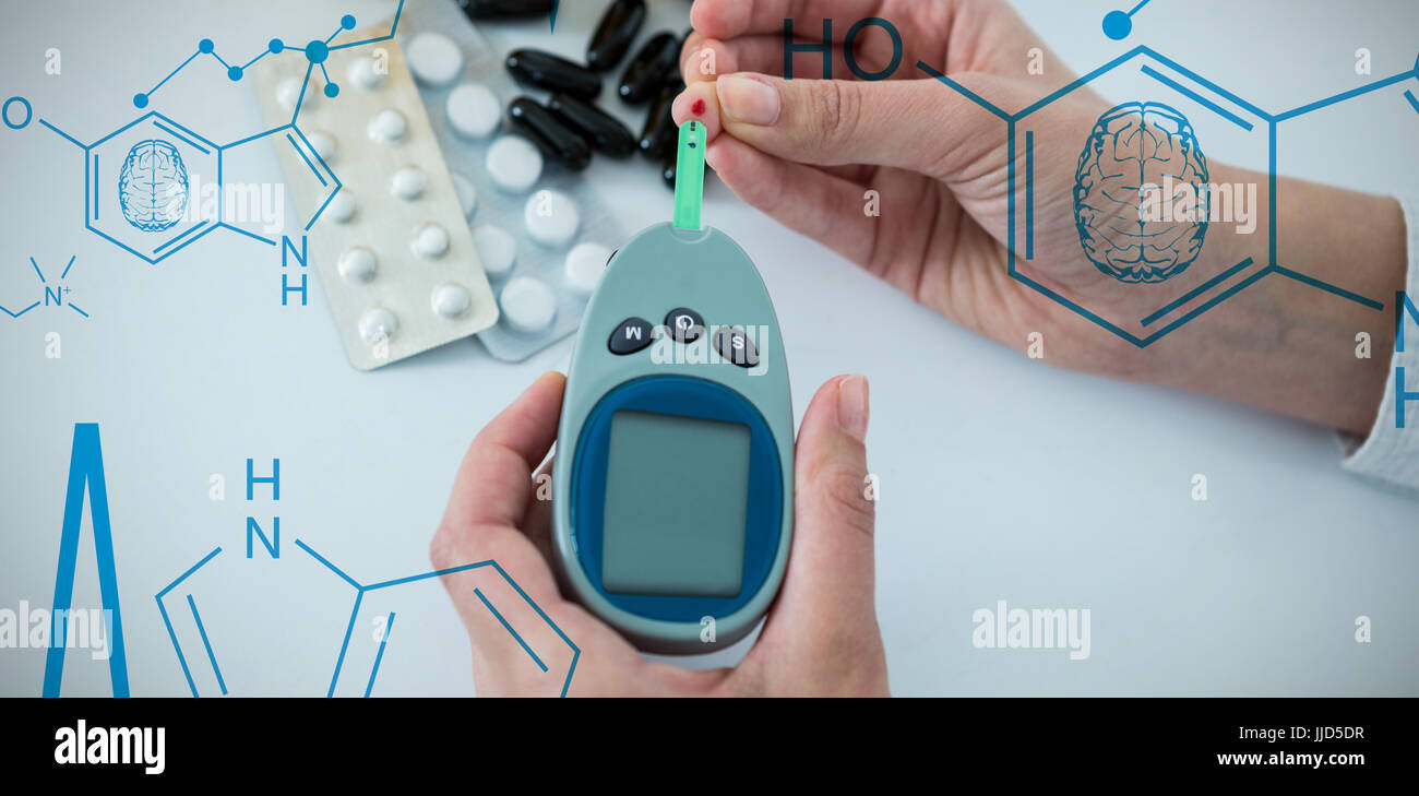 Science graphic against cropped hands of man testing diabetes with ...