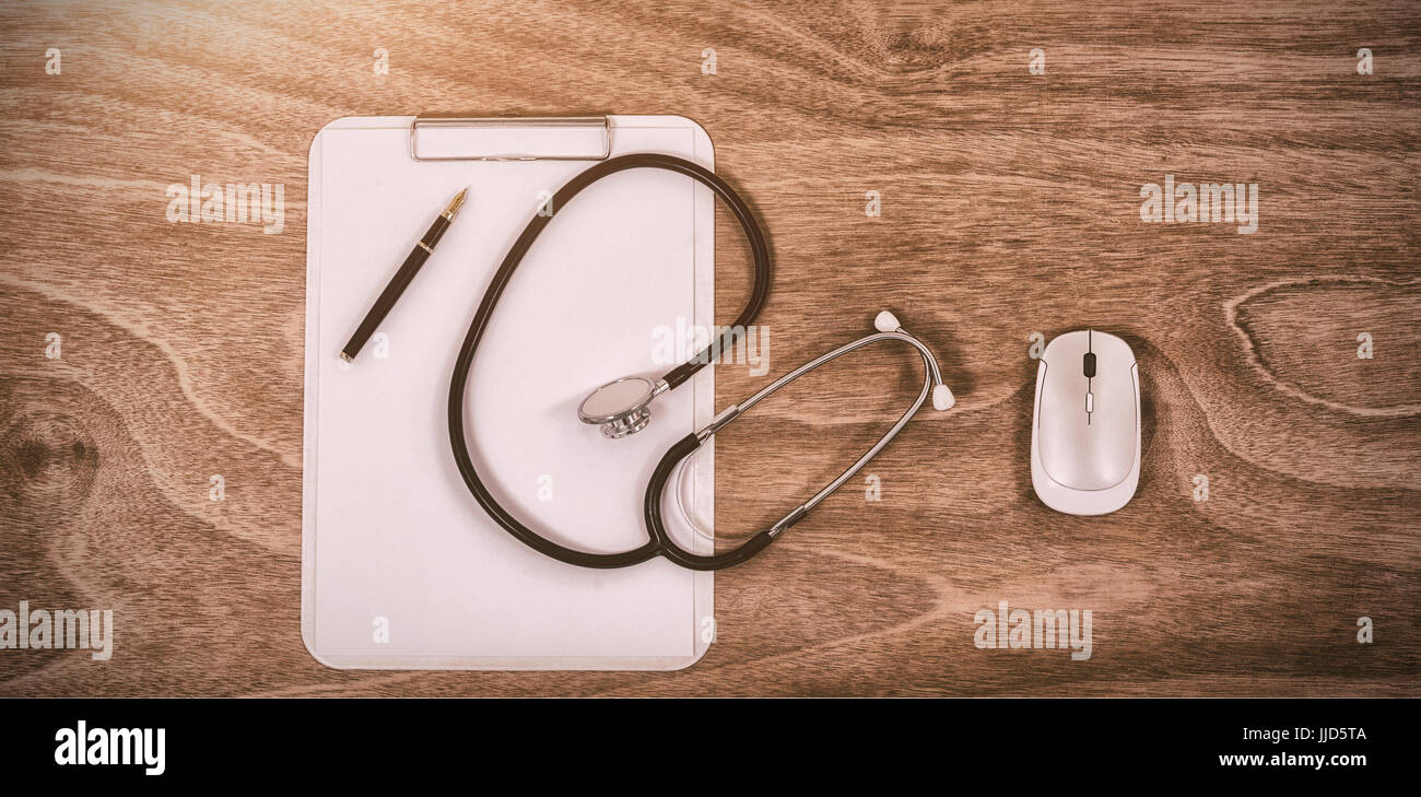 Overhead view of clipboard with keyboard and mouse on table Stock Photo ...