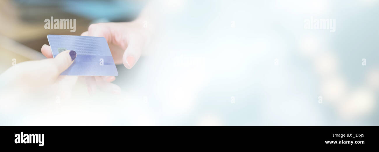 Cropped image of hand handing over credit card at counter of shop Stock ...