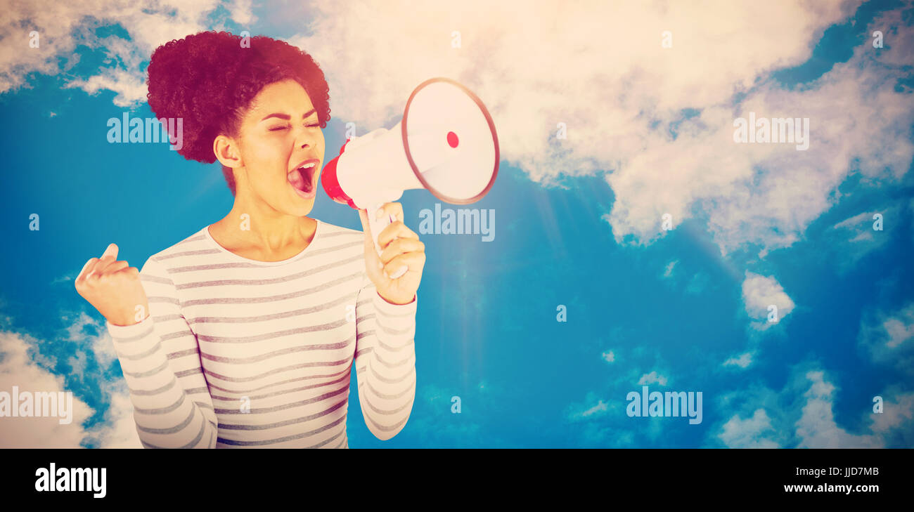 Excited woman shouting megaphone hi-res stock photography and images ...