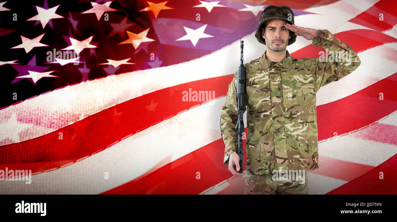 Portrait of soldier with rifle saluting against waving flag of america ...
