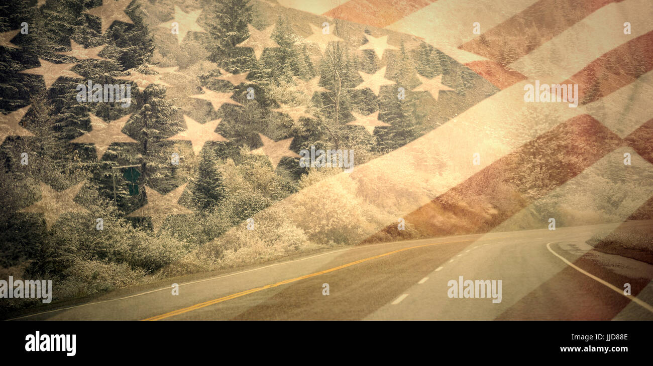 Close up of the us flag against asphalt road through forest Stock Photo ...