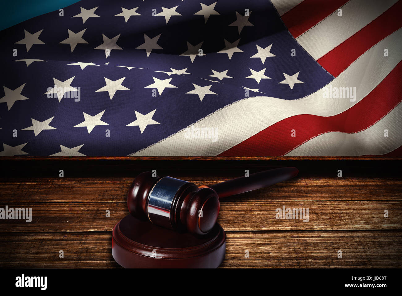 Hammer and gavel against blue vignette background Stock Photo - Alamy