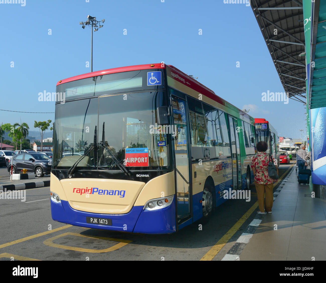 Penang, Malaysia - Mar 9, 2016. A bus stops on street in Penang ...