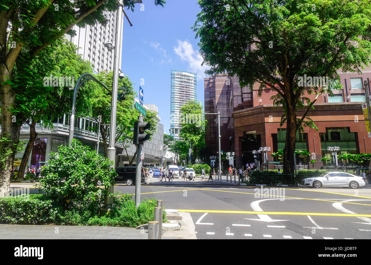 Singapore - Jun 14, 2017. View of Orchard Road with many green trees in ...