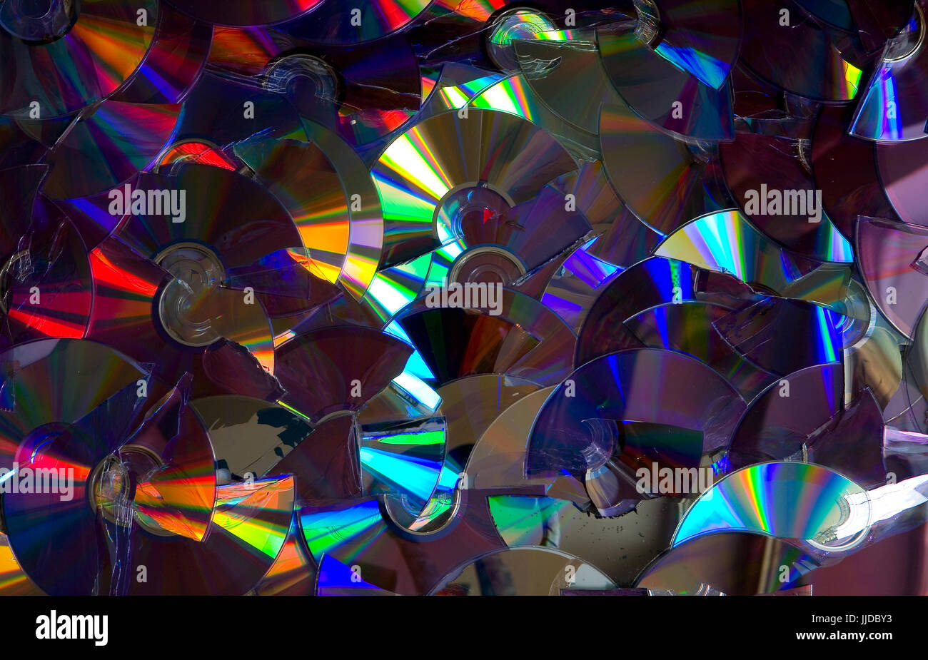 Beautifully iridescent with different colors of broken DVD and CD discs ...