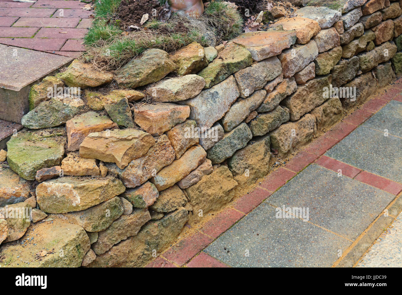 Wall of natural sandstone roughly cracked surfaces Stock Photo - Alamy