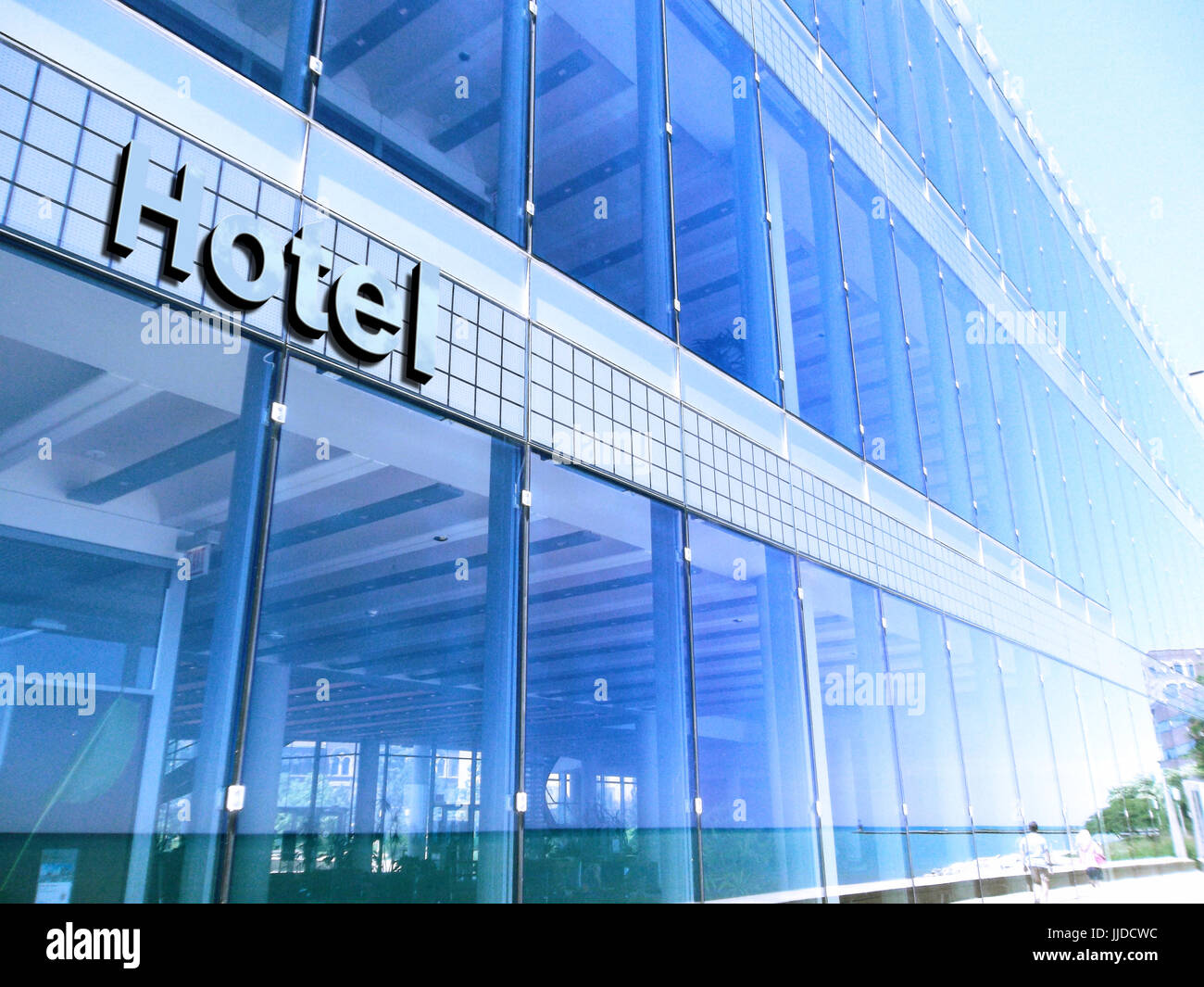 hotel lighted sign on glass building Stock Photo - Alamy