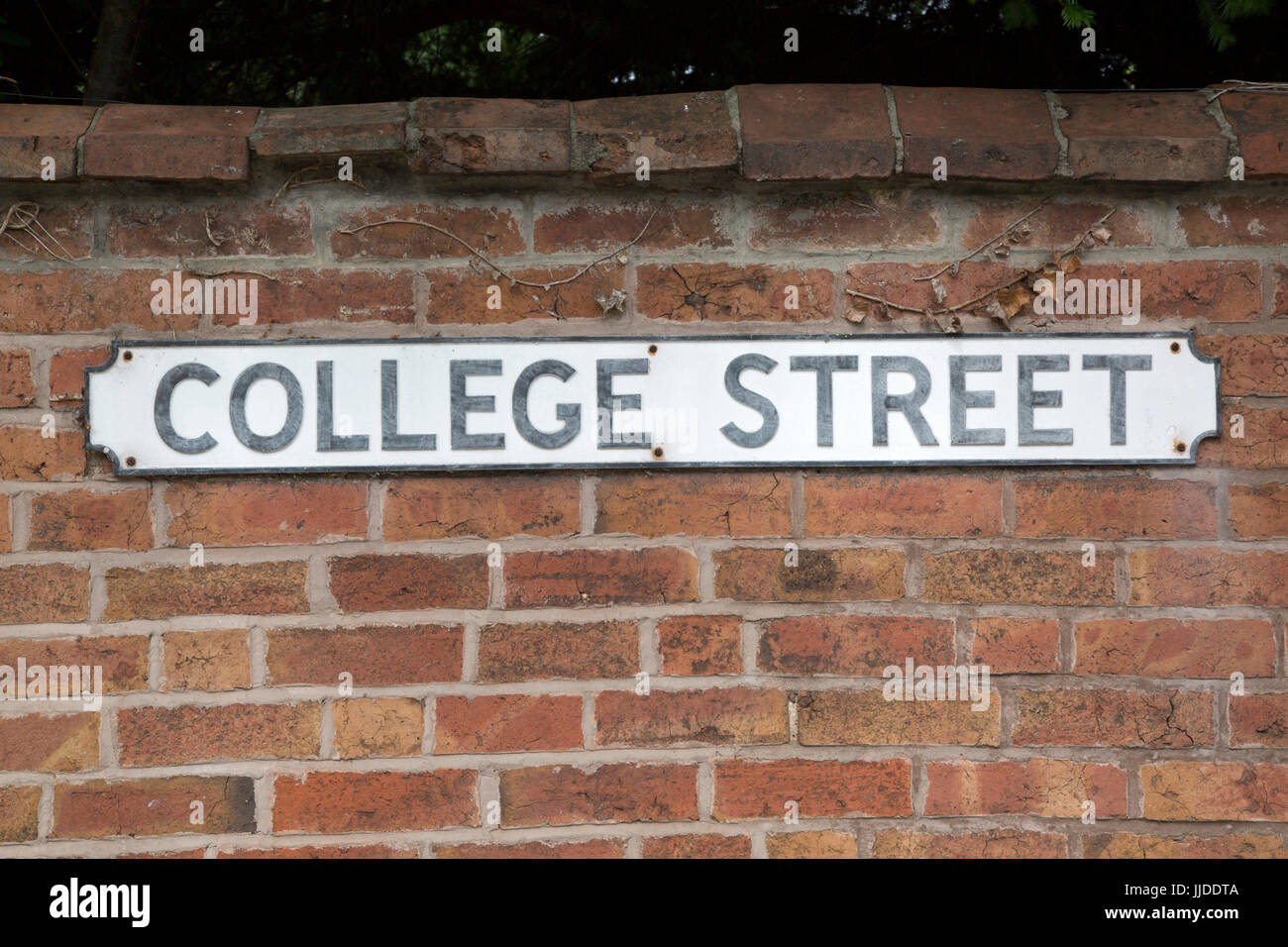 College Street Sign on Red Brick Wall Stock Photo - Alamy